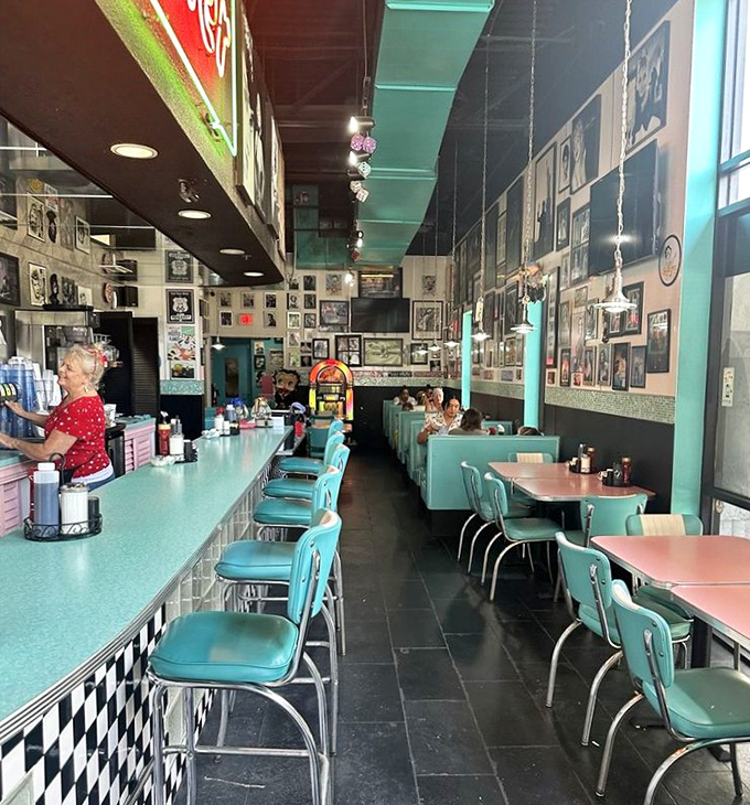 Step inside and suddenly you're Marty McFly without the DeLorean. The turquoise counter, checkerboard trim, and wall-to-wall memories create the perfect backdrop for comfort food magic.