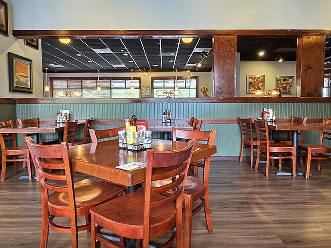 Wooden chairs, mint-green wainscoting, and tables set for carnivorous adventures. No white tablecloths needed when the meat's this good.