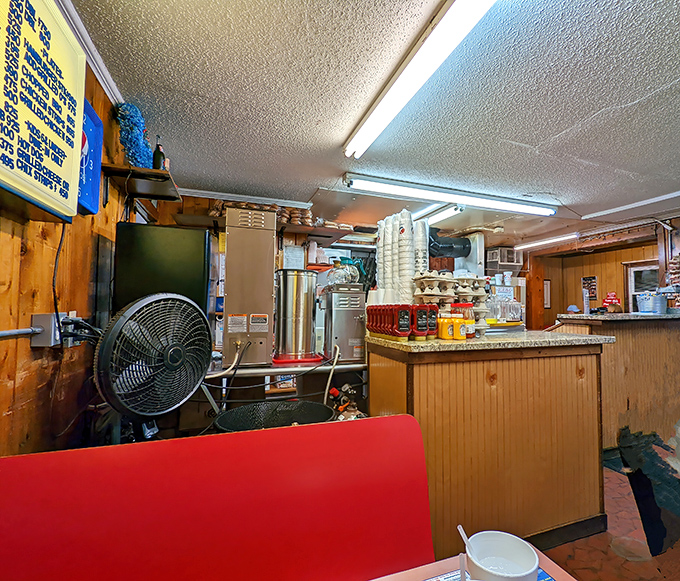 Wood paneling, red booths, and a grill you can watch—this is what restaurants looked like before they needed Instagram.