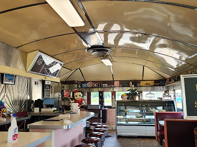 Step inside and the curved ceiling whispers stories of decades past, while those counter stools practically beg you to spin once before settling in.