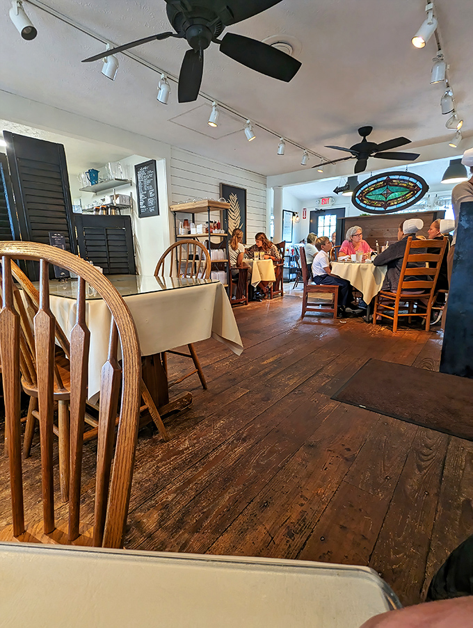 Wide-plank floors and white shiplap walls create the perfect backdrop for culinary magic. This isn't farmhouse chic&mdash;it's the real deal.