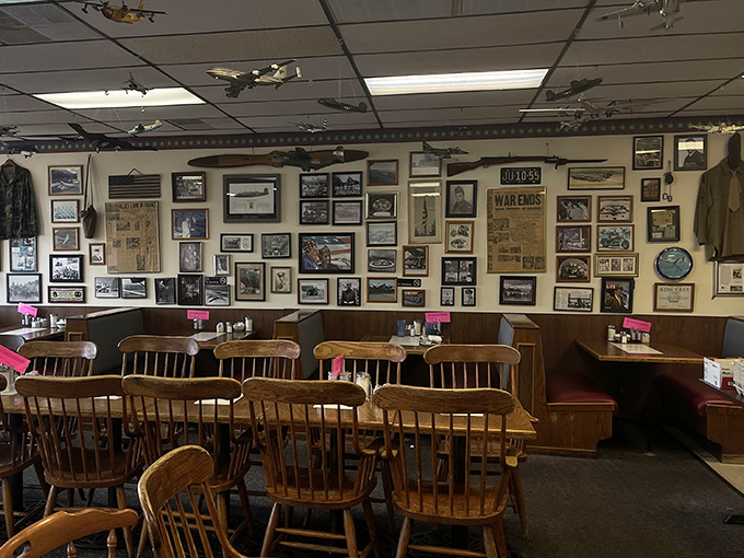 Aviation history covers every inch of wall space, creating a museum-like atmosphere where your breakfast comes with a side of nostalgia.