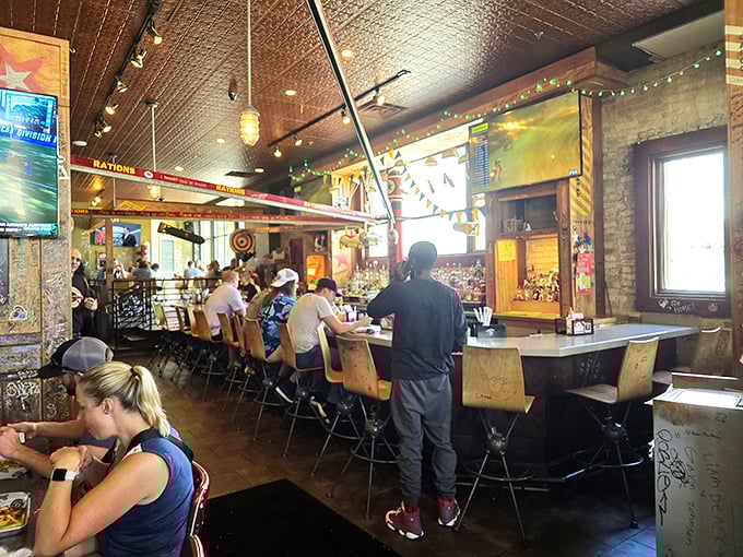 Where industrial chic meets comfort food haven. The pressed tin ceiling and warm lighting create the perfect backdrop for burger-induced bliss.