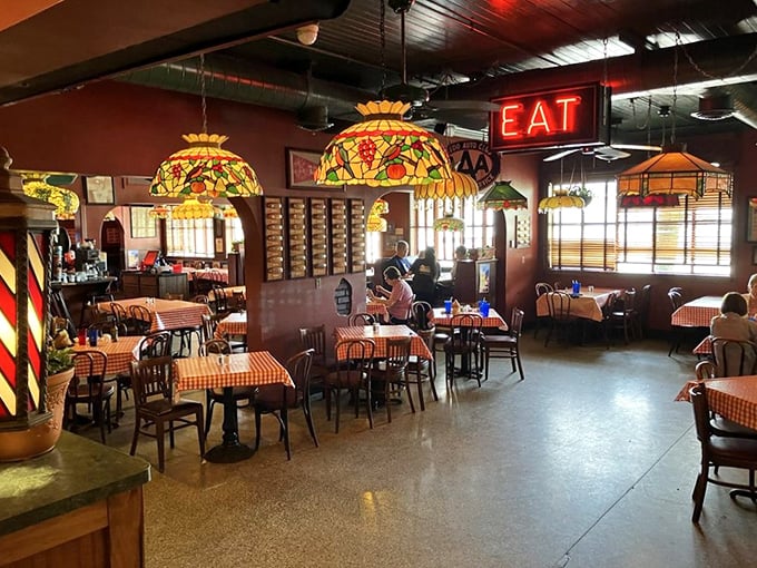 Tiffany-style lamps cast a warm glow over red-checkered tablecloths, creating the perfect backdrop for comfort food conversations and Hungarian-inspired indulgence.