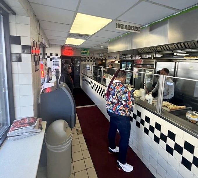 The no-nonsense interior speaks volumes: checkered counters, straightforward service, and a singular focus on crafting the perfect sandwich experience.