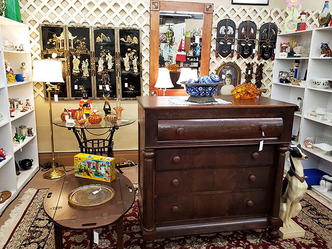 Vintage furniture and collectibles create a perfectly curated vignette &ndash; like walking into your stylish grandmother's dream living room.