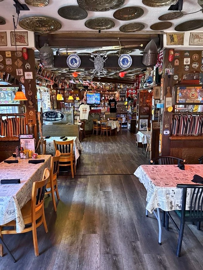 Step inside and prepare for sensory overload &ndash; brass plates gleam overhead while newspaper-covered tables invite you to settle in for a proper feast.