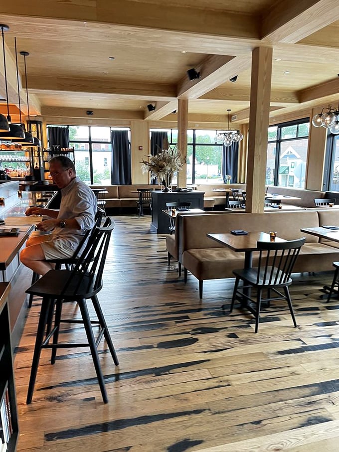 Warm wood tones, natural light, and thoughtful design create a dining room that feels both rustic and refined.