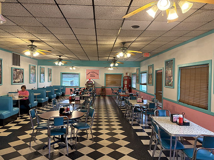 Step back in time with this classic black-and-white checkered floor and blue vinyl booths. The diner's interior is a love letter to 1950s Americana.