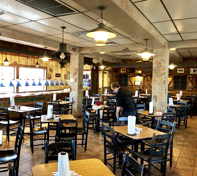 Simple wooden tables and warm lighting create the perfect backdrop for serious eating – no Instagram filters needed here.