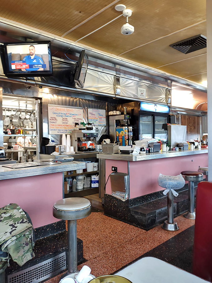 The pink counter and chrome stools whisper sweet nothings about simpler times and perfect eggs over easy.