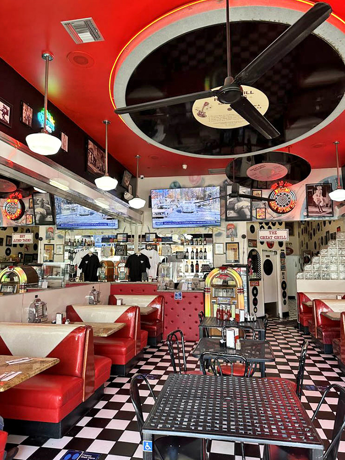 That checkered floor and red vinyl combo hits differently when you're holding the perfect patty melt.