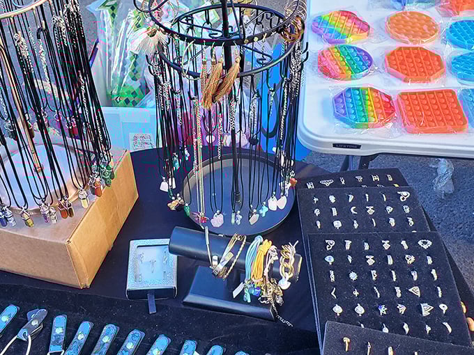 Jewelry displays transform ordinary tables into treasure chests, where colorful pendants and pop-it fidgets compete for attention.