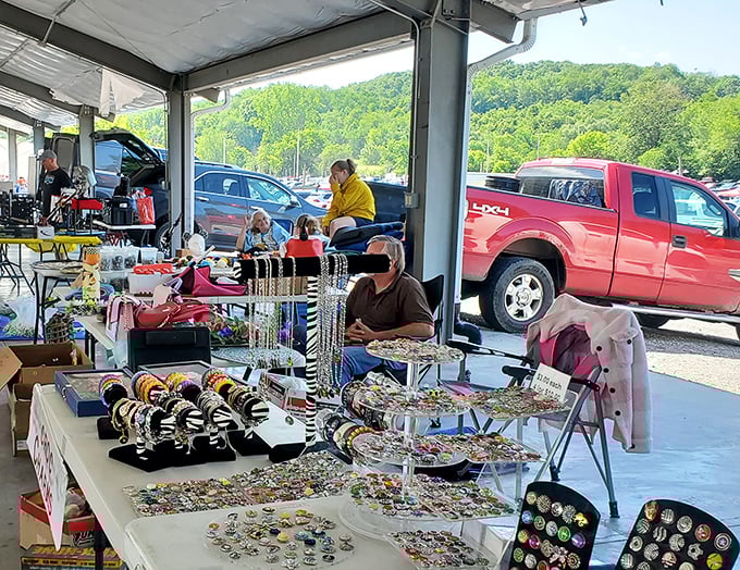 Jewelry displays shimmer under the market lights, where handcrafted beadwork meets vintage costume pieces. Each table tells stories of fashion eras gone by.
