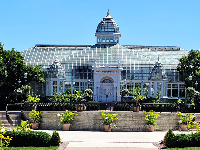Victorian elegance meets botanical wonderland. The Palm House stands like a crystal palace, promising exotic treasures within its sun-drenched walls.