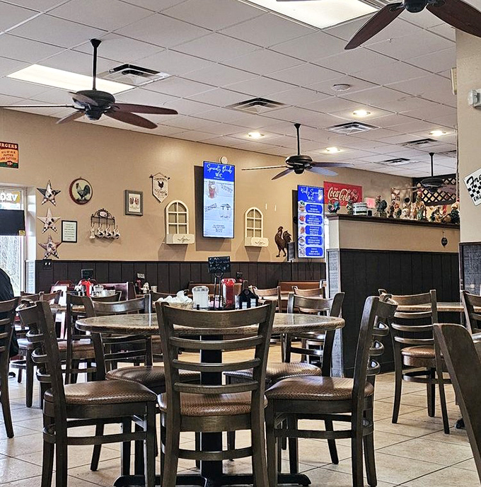 Country charm meets breakfast perfection inside Woodsby's, where ceiling fans lazily spin above tables that have witnessed countless coffee refills and satisfied sighs.
