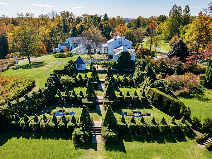 Aerial artistry: geometric precision meets botanical brilliance in this bird's-eye view of Ladew's meticulously designed garden rooms.