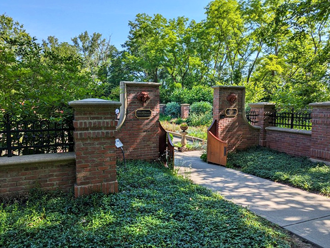 This brick gateway leads to gardens that make your backyard tomatoes feel like underachievers.