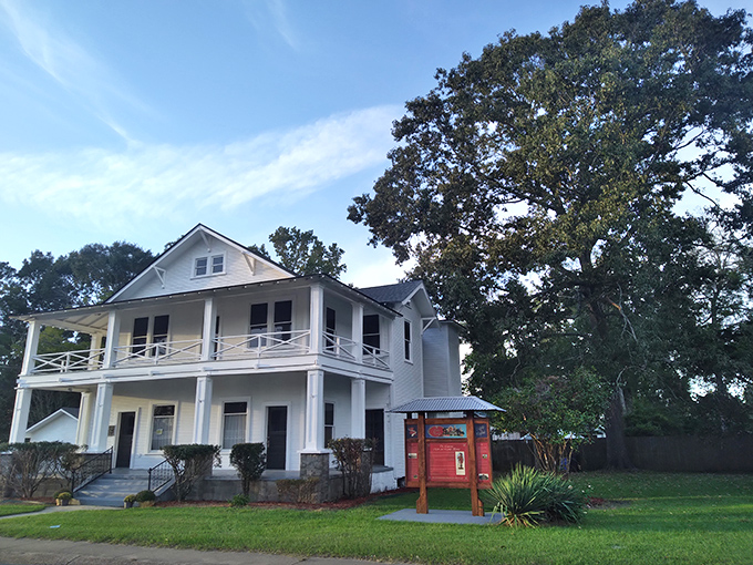 This classic Southern home with its wraparound porch practically whispers "come sit a spell" to everyone passing by.