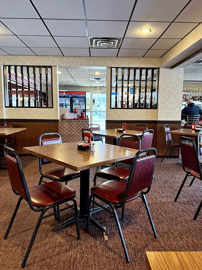 Classic diner seating that's seen generations of satisfied customers. Those burgundy chairs have supported more happy diners than a therapist's couch.
