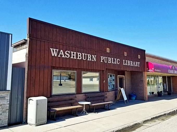 The Washburn Public Library &ndash; where books and community converge. Those wooden benches outside aren't just for show; they're conversation starters.