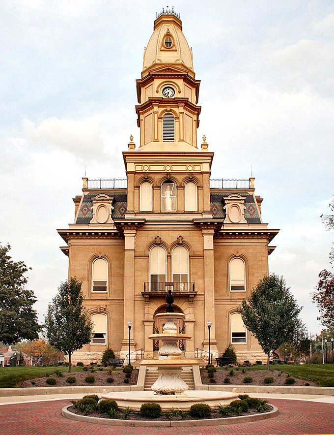 The Logan County Courthouse stands downtown like a wedding cake designed by architects who believed beauty was a civic duty.