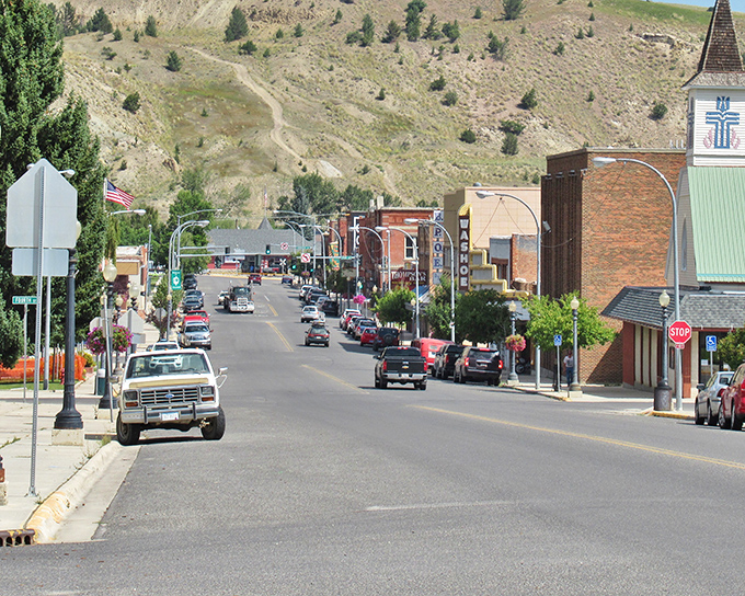 Brick buildings frame the view as mountains stand sentinel over Anaconda's historic downtown, a scene unchanged for generations.