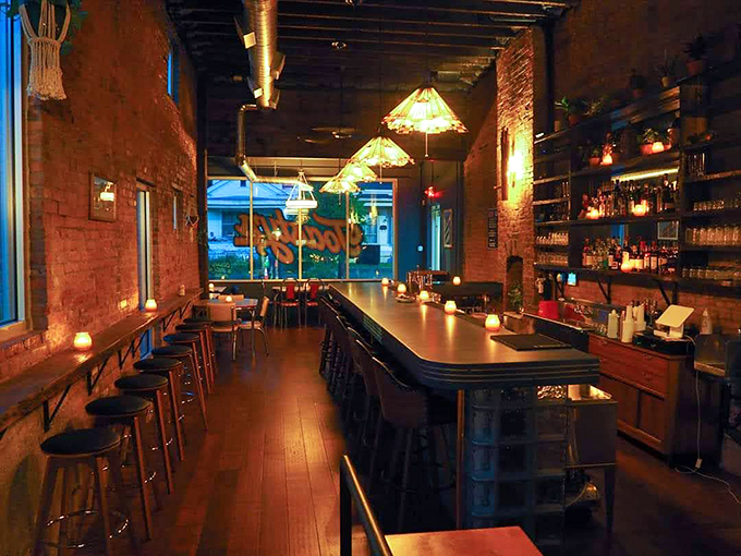 Warm brick walls, soft lighting, and a bar that beckons you to pull up a stool and stay awhile.