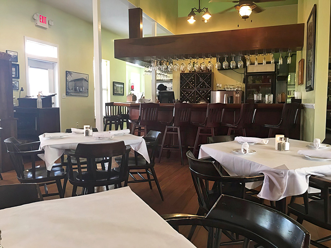 The dining room strikes that perfect balance between "nice enough for your anniversary" and "comfortable enough to lick your plate."
