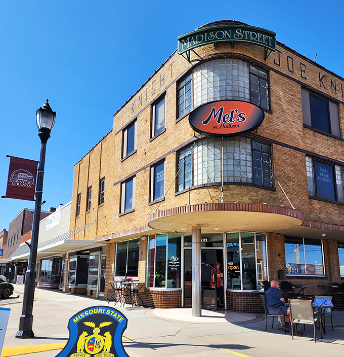 Mei's on Madison occupies the iconic Joe Knight building, where curved windows and golden brick have witnessed decades of downtown conversations.