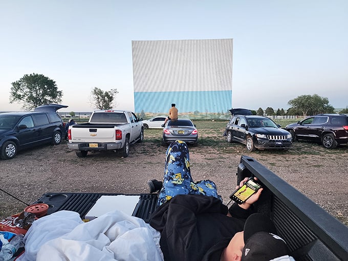 The ultimate living room setup &ndash; blankets in the truck bed, snacks at the ready, and a movie screen bigger than your house.