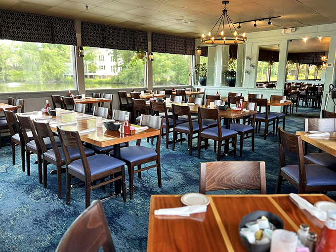 Blue carpet meets wooden tables in this dining room where conversations flow as freely as the sweet tea and seafood platters.