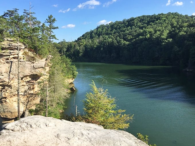 Where sandstone meets serenity. These dramatic cliffs rising from emerald waters make you wonder if Kentucky secretly borrowed a piece of the Pacific Northwest.