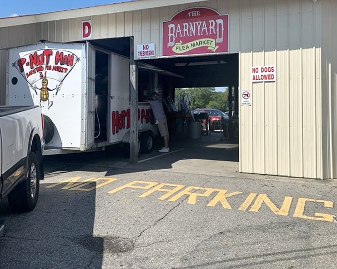The iconic P-Nut Man truck parked at the entrance – a South Carolina institution serving boiled peanuts to bargain-hungry shoppers.