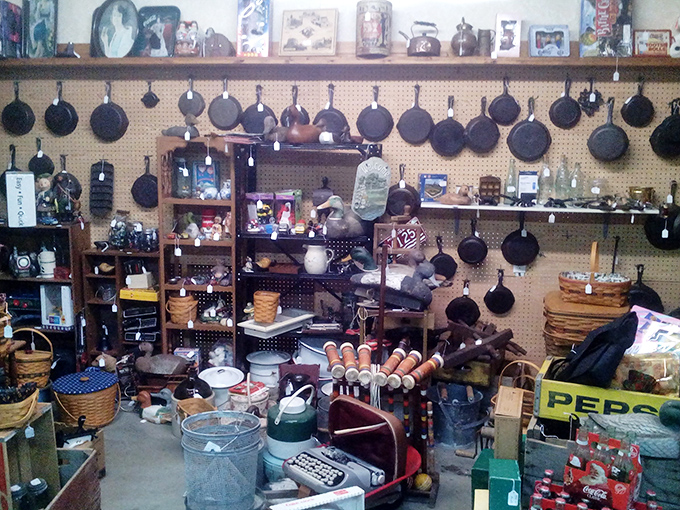 Cast iron pans hang like culinary medals of honor, each one seasoned with decades of family memories.