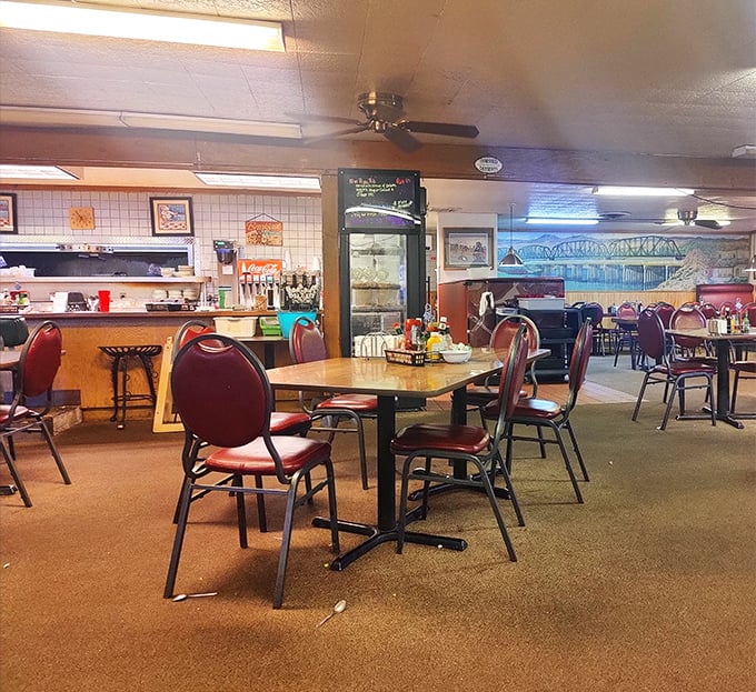 Classic diner ambiance with those unmistakable red vinyl chairs &ndash; where conversations flow as freely as the coffee and nobody's checking their Instagram.