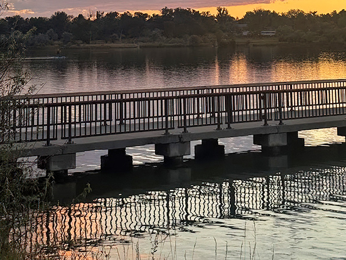 Sunset transforms this ordinary pier into nature's runway, where the sky models its most extravagant evening wear collection.