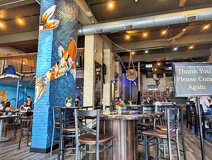 The interior strikes that perfect balance between "fancy fish joint" and "comfortable enough to wear jeans." Those koi murals are practically swimming off the walls!