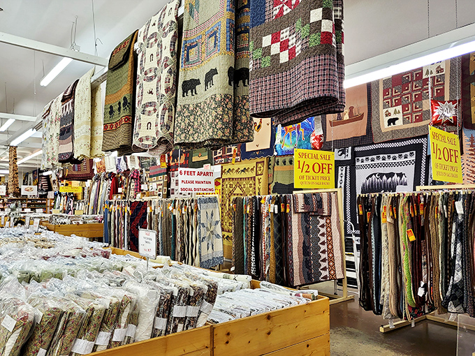 Handcrafted quilts hang like textile masterpieces, each stitch telling Appalachian stories while "50% OFF" signs whisper sweet nothings to your wallet.