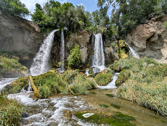 The star of the show: three distinct waterfalls plunging 70 feet over limestone cliffs, like nature decided one waterfall simply wasn't showing off enough.