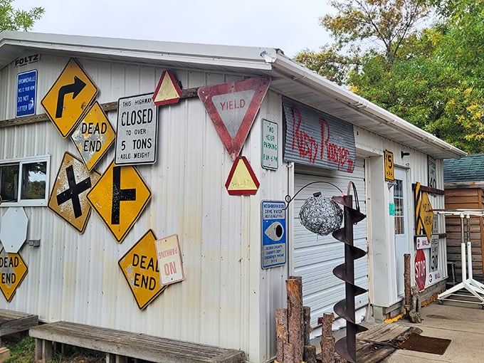 This building doesn't just display road signs&mdash;it's practically wearing them like merit badges earned through decades of "you never know what you'll find" shopping.
