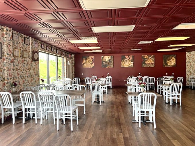 Simple white chairs and burgundy walls create the perfect stage where pie becomes the undisputed star of the show.