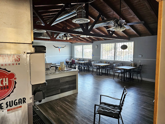 Simple tables, exposed beams, and a longhorn watching over the proceedings&mdash;this isn't fancy, because the meat deserves all your attention.