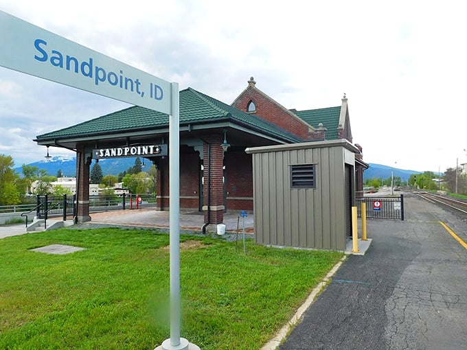 The Sandpoint Amtrak Station sits like a postcard from another era, mountains rising in the background as if to say, "Take your time, the scenery isn't going anywhere."