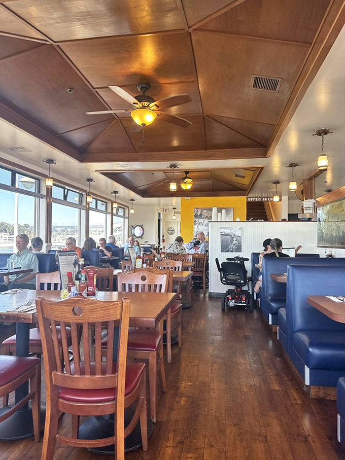 Warm wooden interiors and nautical touches create the perfect backdrop for seafood feasting, with windows framing the spectacular Pacific views.