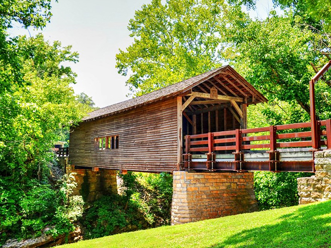 Summer sunshine bathes the bridge in warm light, creating that perfect "I should frame this" moment every Tennessee road trip deserves.