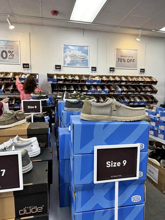 Rows of shoes organized by size make finding your perfect fit easier than parallel parking in an empty lot.