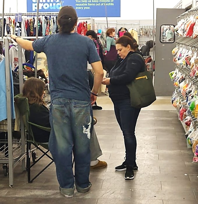 Families navigate the aisles together, proving thrifting is a multi-generational sport where patience and persistence pay off in unexpected finds.