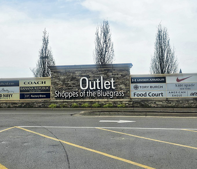 This stone marquee serves as the retail equivalent of pearly gates, where brand names and budget-friendly prices live in perfect harmony.