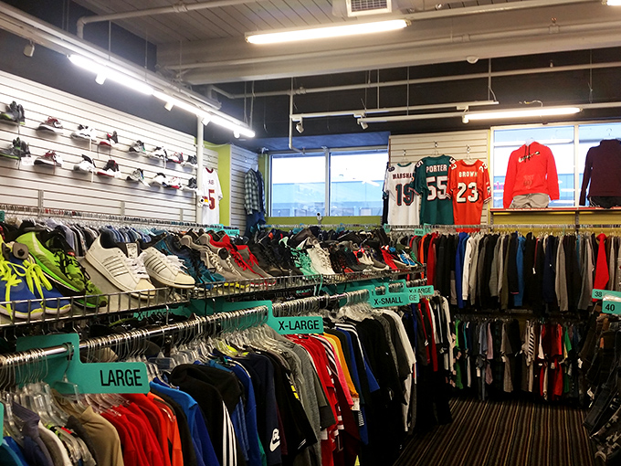 A rainbow of athletic jerseys and casual wear awaits, organized by size for those who prefer treasure hunting without the chaos.
